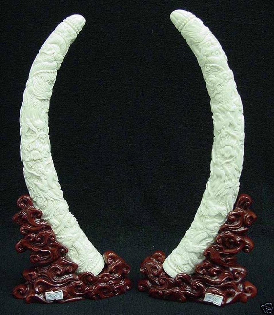 PAIR OF COW BONE DRAGON TUSKS