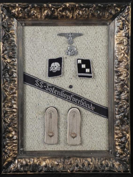 FRAMED COLLECTION OF NAZI SS INSIGNIA VISOR DEVICES