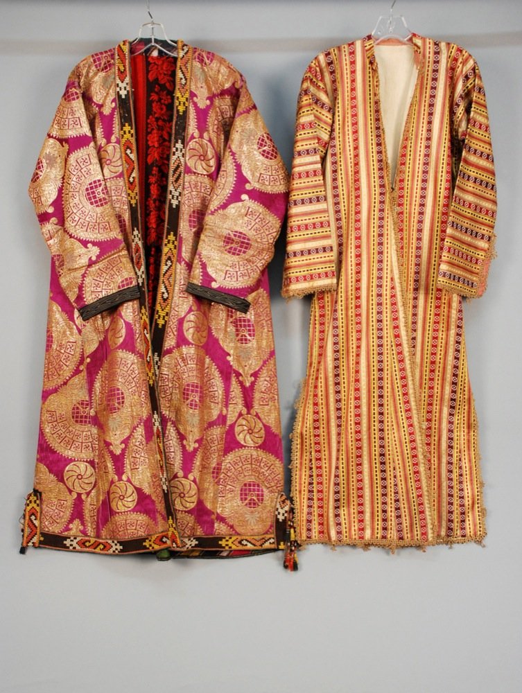 TWO ETHNIC SILK ROBES, 20th C. Probably central Asian: