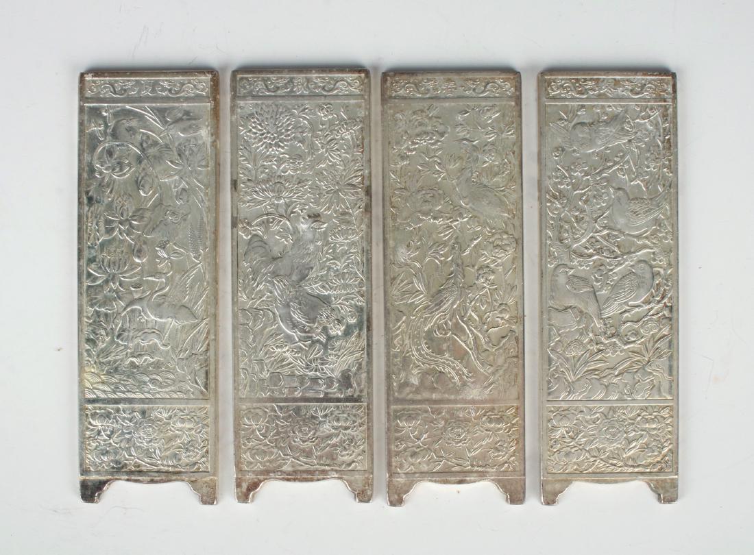 FOUR CHINESE SILVER SCROLL WEIGHTS
