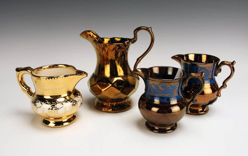 Four Lusterware Pitchers