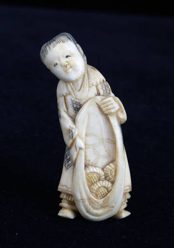 Netsuke Of Flower Vendor With Bag Of Sunflowers