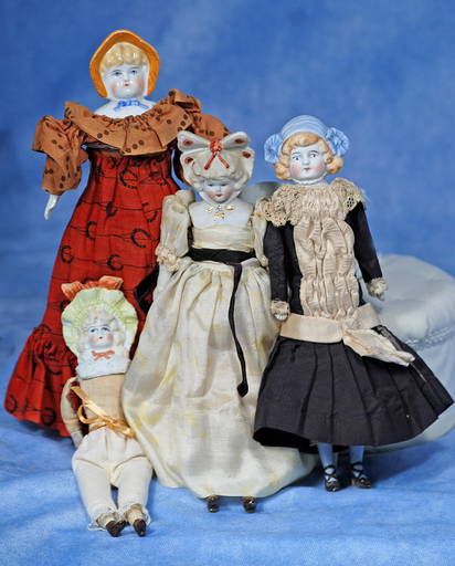 Four German Bonnet Head Dolls.