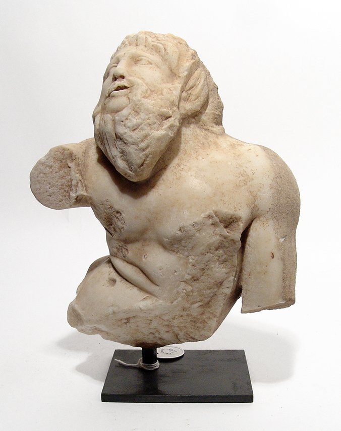A gorgeous Roman marble bust of a muscular satyr