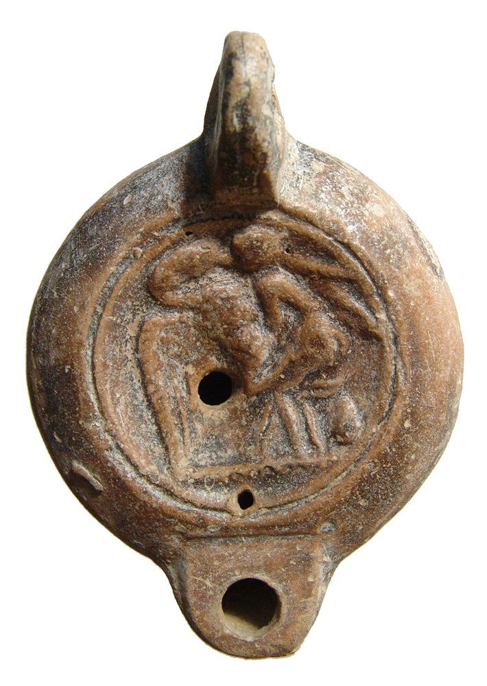 Roman pottery oil lamp depicting Leda and the Swan