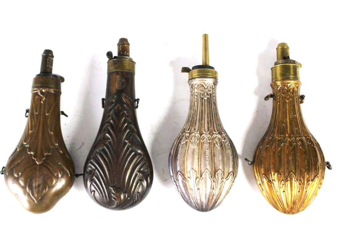 Four Repousse Metal Powder Flasks