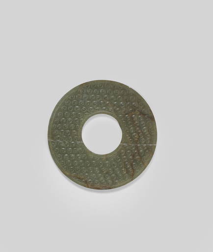 An Archaic Green And Russet Jade Disc, Bi Warring
