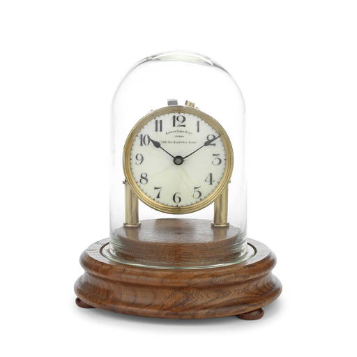 An early 20th century brass and enamel Eureka 'Clock' the dial signed ...