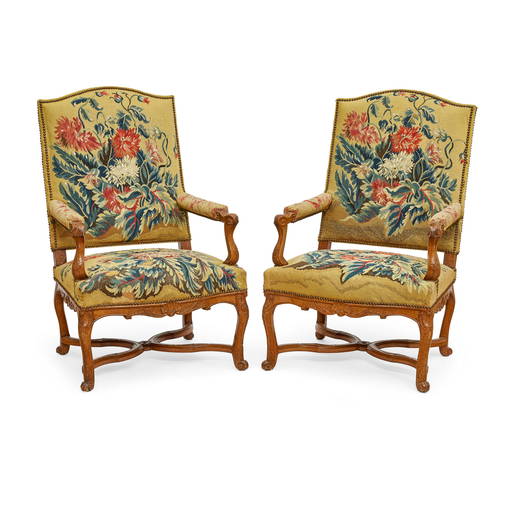 A PAIR OF RÉGENCE NEEDLEPOINT UPHOLSTERED WALNUT FAUTEUILS À LA ...