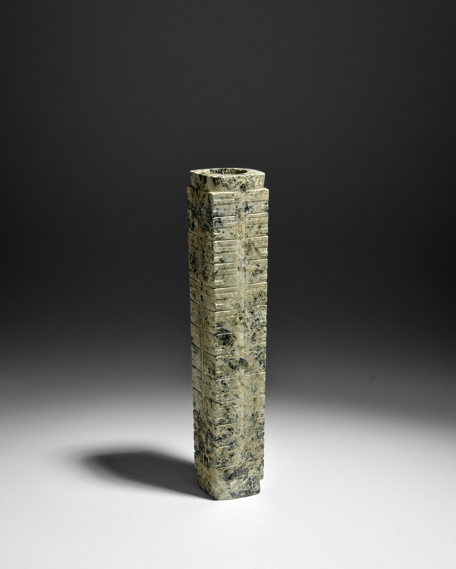 A LARGE NEOLITHIC MOTTLED GREY JADE CONG Liangzhu Culture, circa 3000 ...