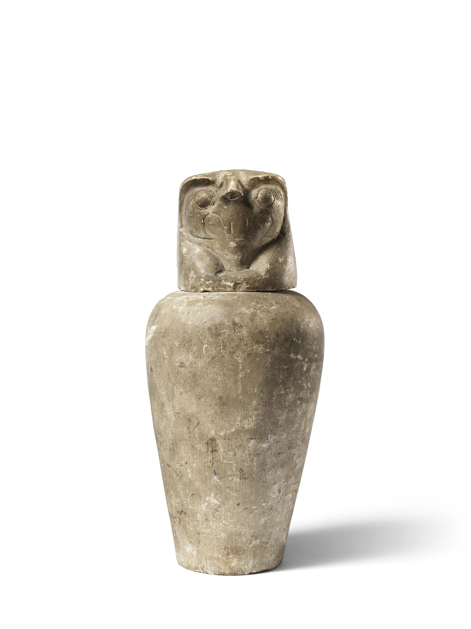 An Egyptian Limestone Canopic Jar Of Falcon Headed Qebehsenuef