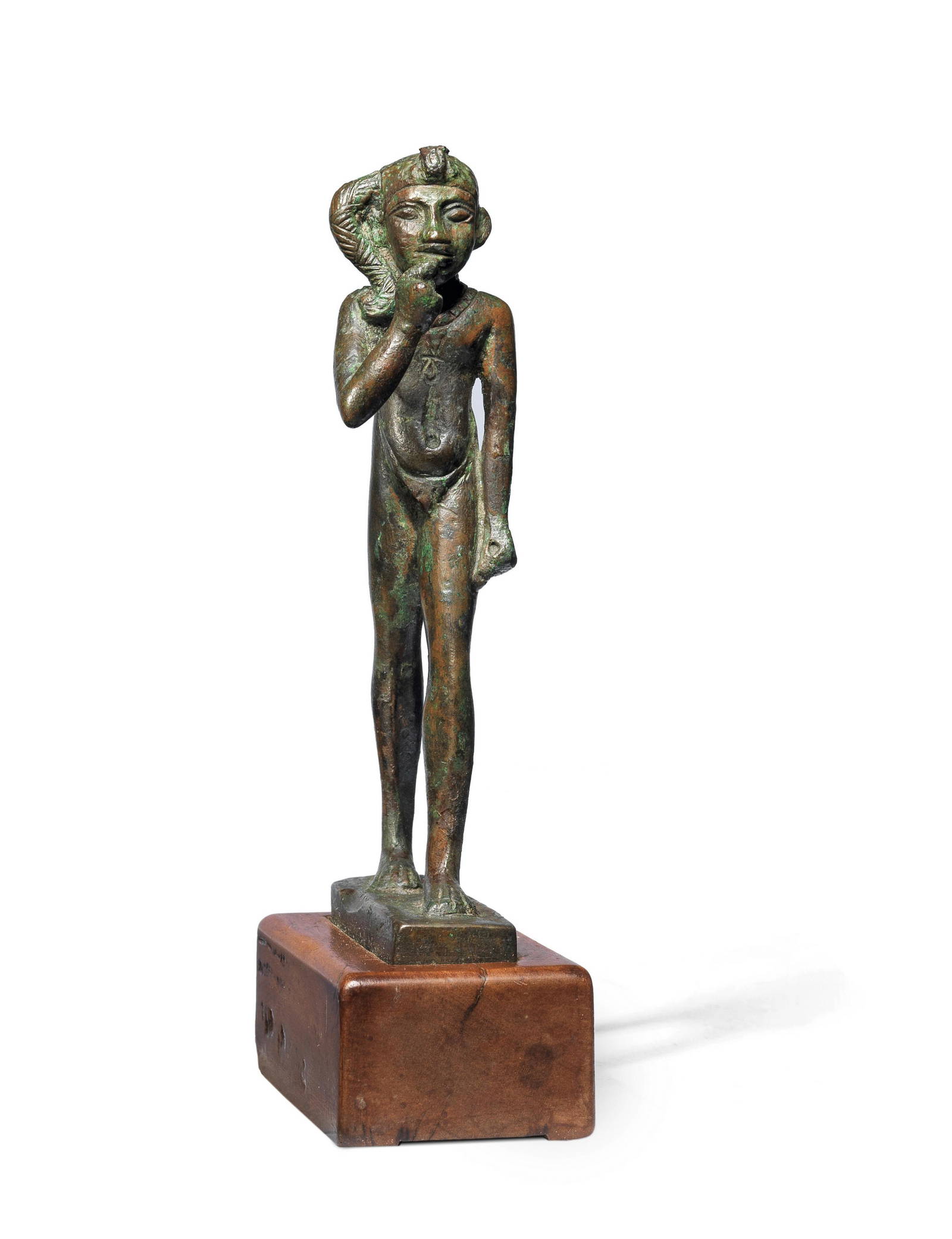 An Egyptian Bronze Figure Of Harpocrates Auction