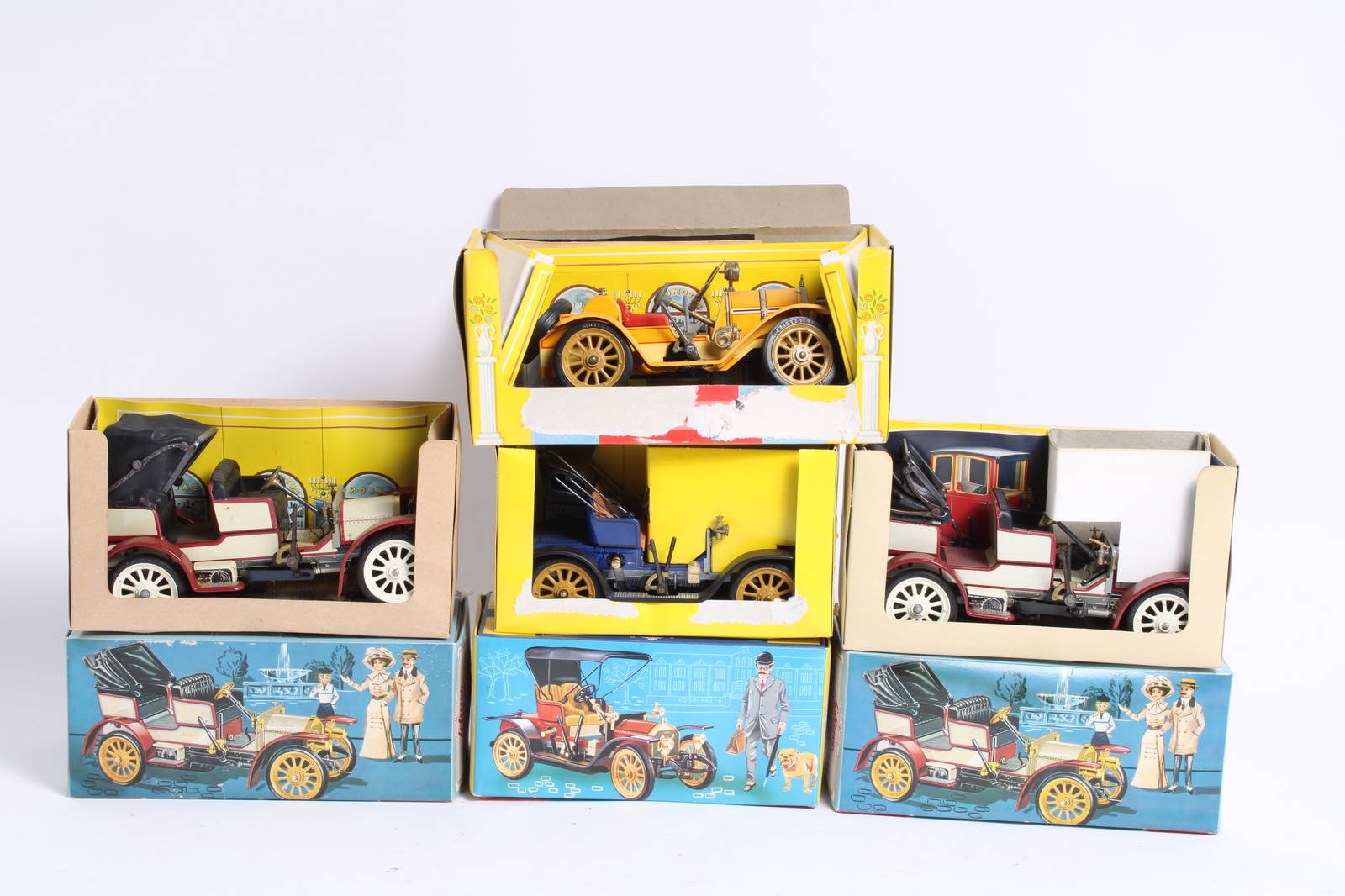 Four Schuco 'oldtimer' Clockwork Cars Auction