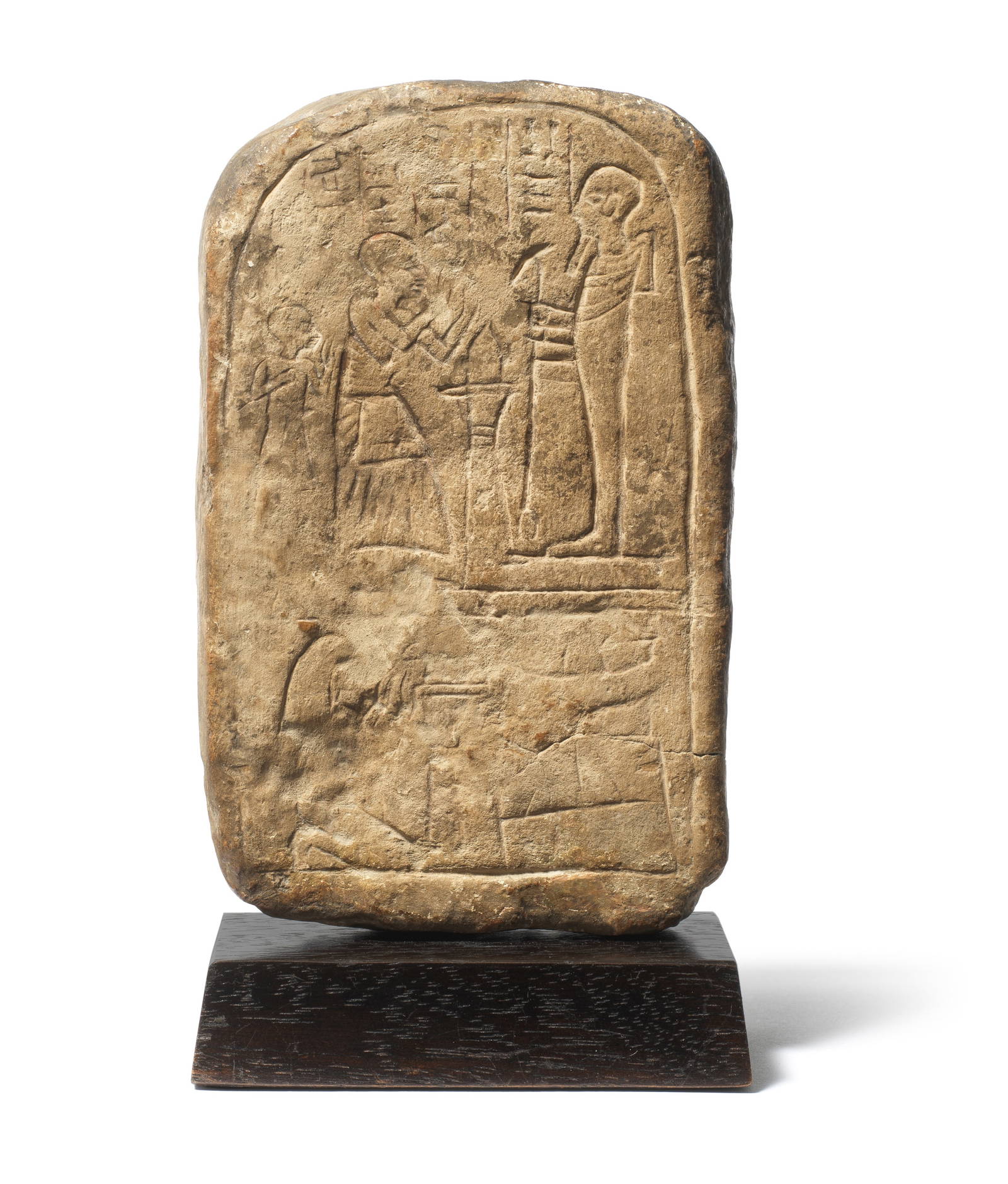 A Small Egyptian Limestone Round-topped Stele With Ptah Auction