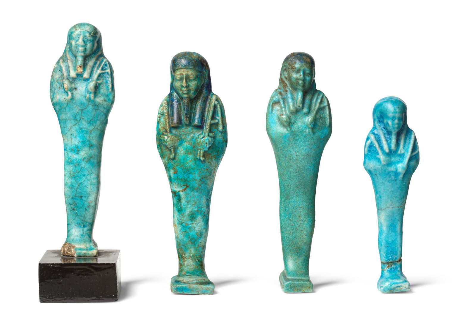 Two Egyptian Turquoise Faience Shabtis And Two Egyptian Bichrome ...