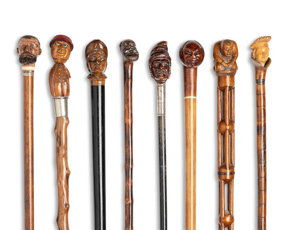 A Collection Of Eight Carved Wood Novelty Walking Sticks And Canes Late ...