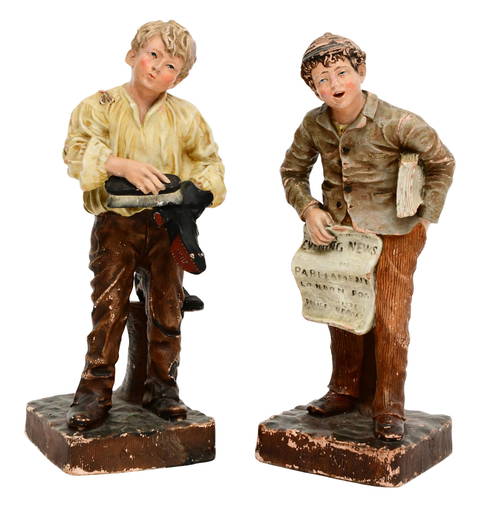 Two Painted Plaster Boy Figurines