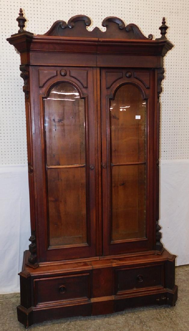 2 door American Vict walnut step back bookcase.