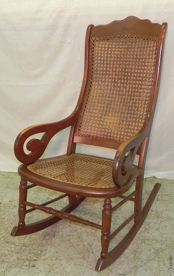 204: Cane back antique rocker.