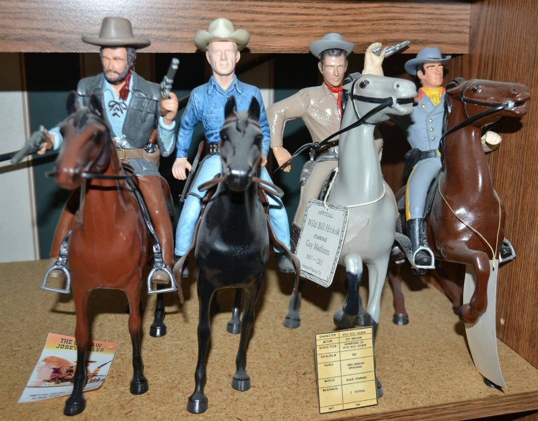 Four Western Hartland figures and horses
