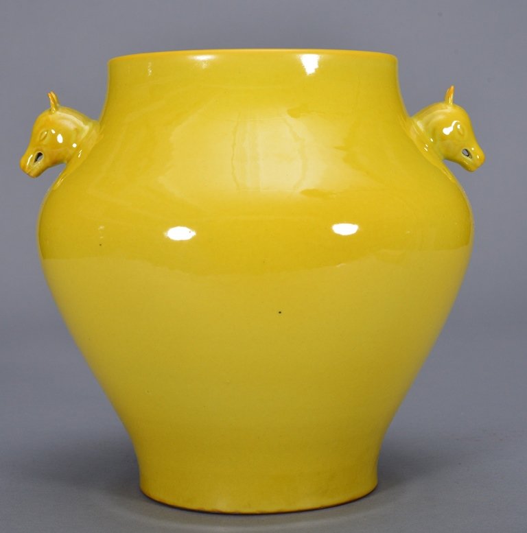 A LARGE YELLOW-GLAZED JAR