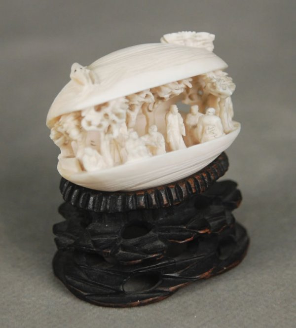 281: Chinese carved ivory clam shaped display with figu