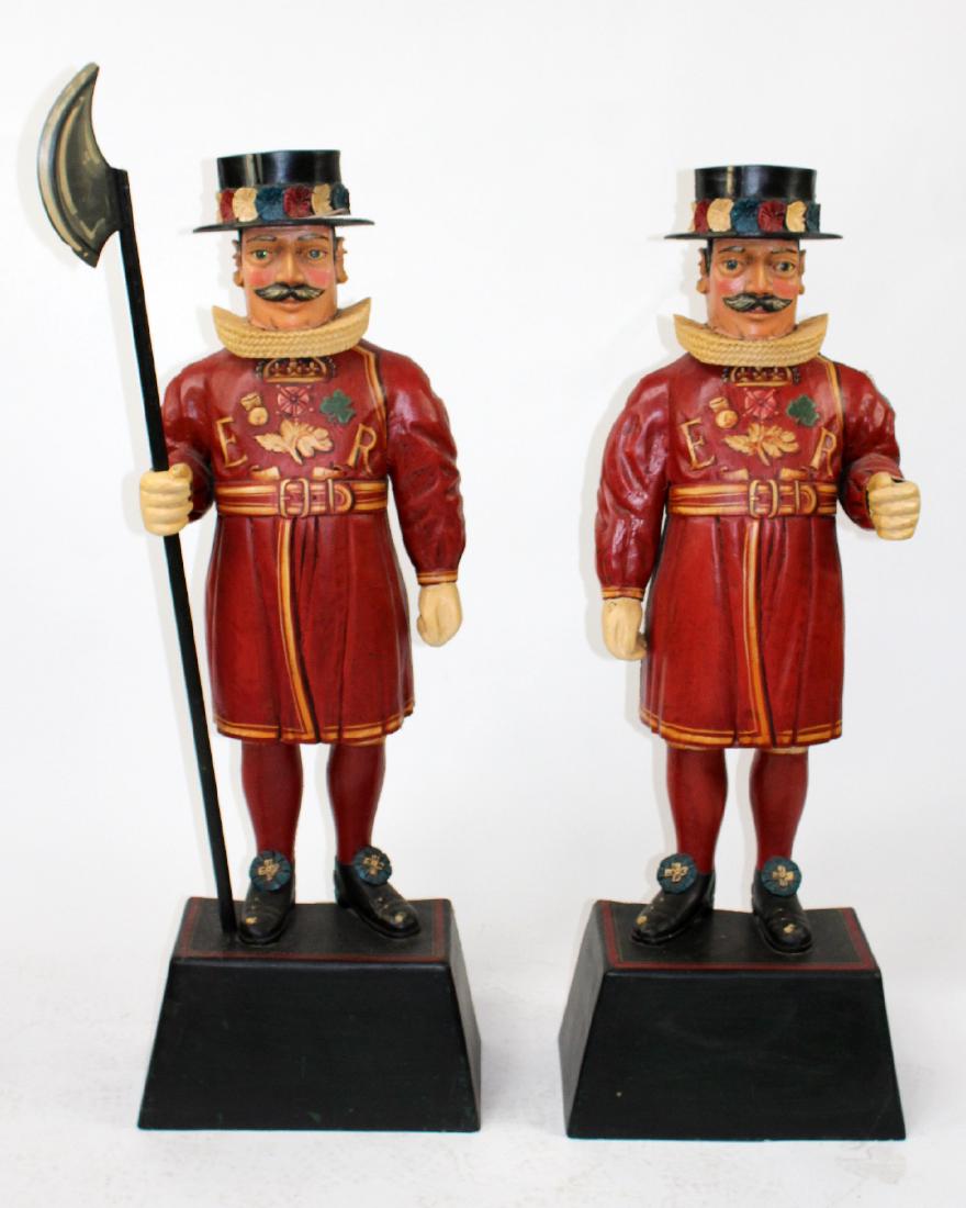 Pair of cast beefeater statues