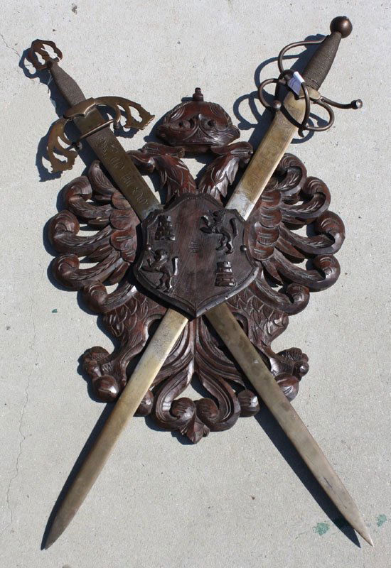 185: Carved wood coat of arms with crossed swords