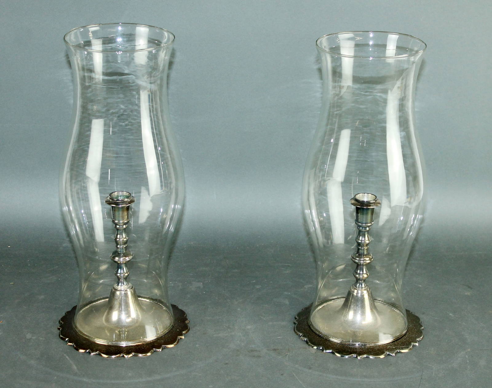 Pair Of Silver Plated Candlesticks With Glass Hurricanes Auction