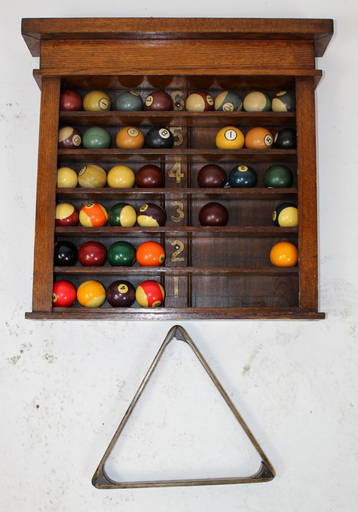 Antique Pool Balls In Wall Mount Rack