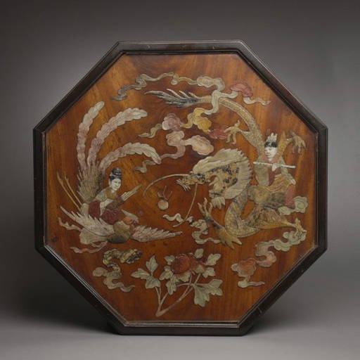 An Octagonal Hanging Panel With Stone Overlay