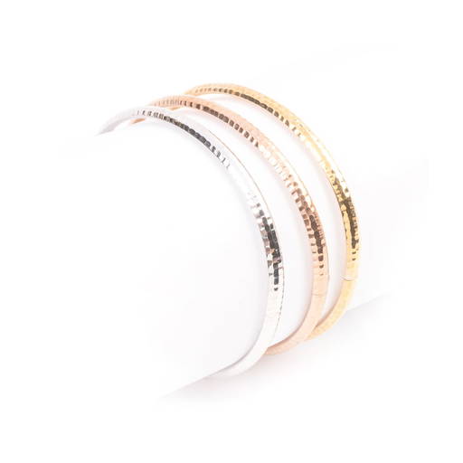 Three 14k Tricolor Gold Stacking Bracelets.