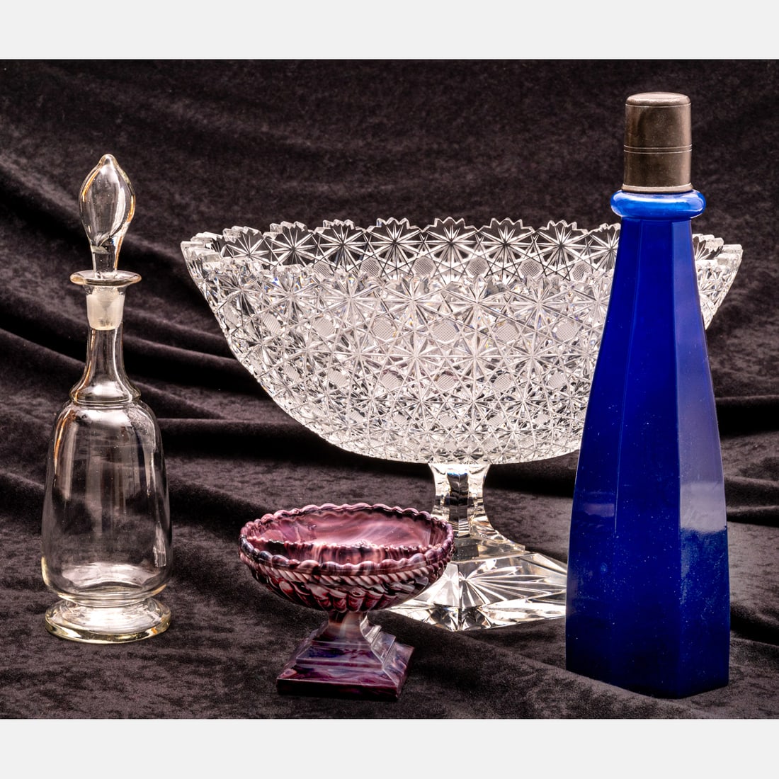 Four Colored And Clear Glass Decorative Items Auction