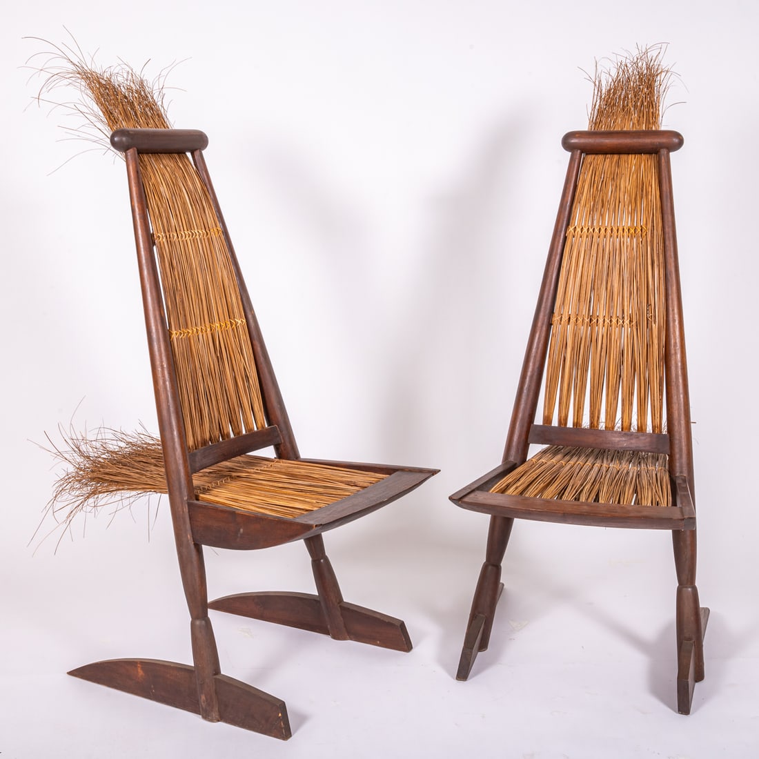 A Pair Of Teak And Raffia Chairs Auction