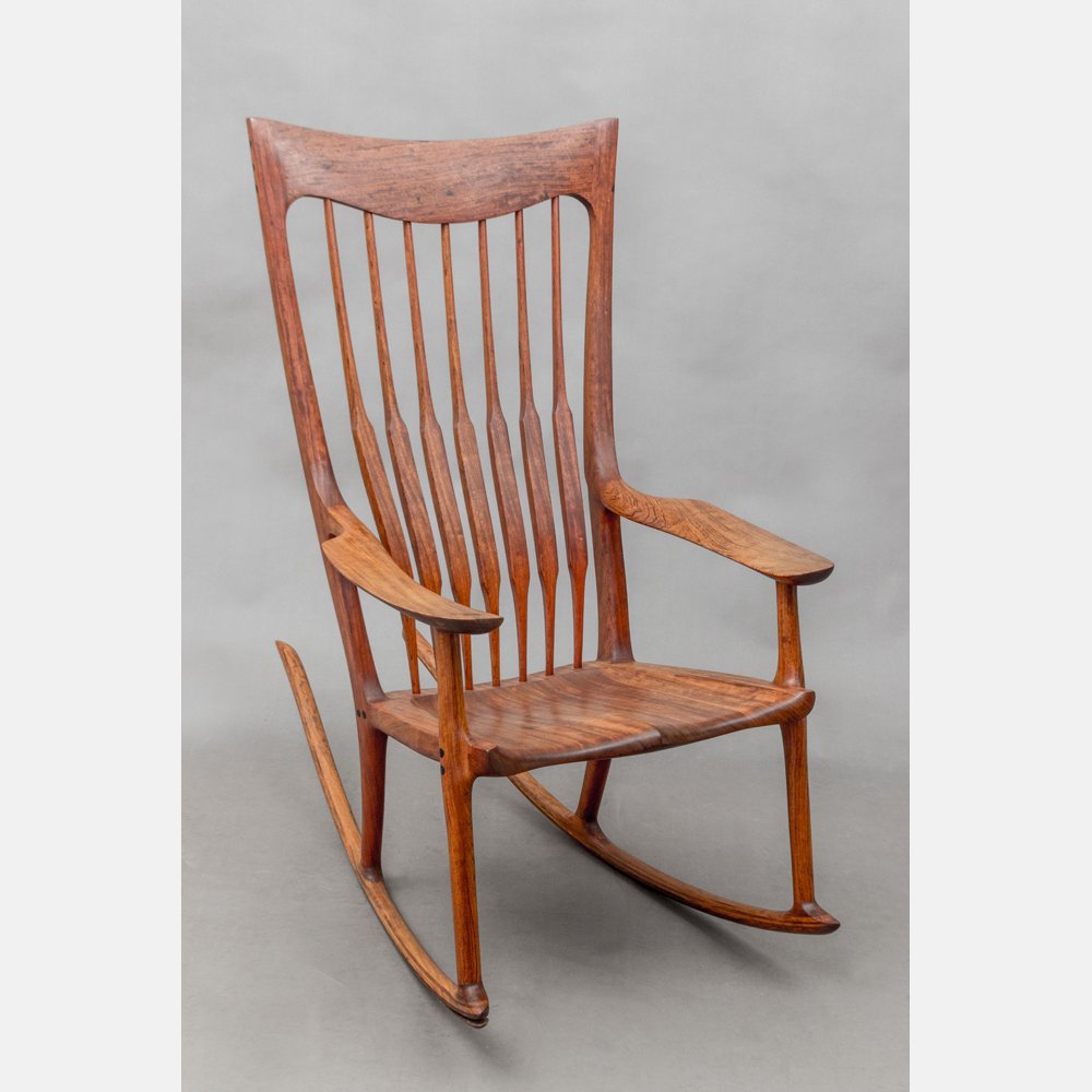 A Contemporary Rosewood Rocking Chair By Scott