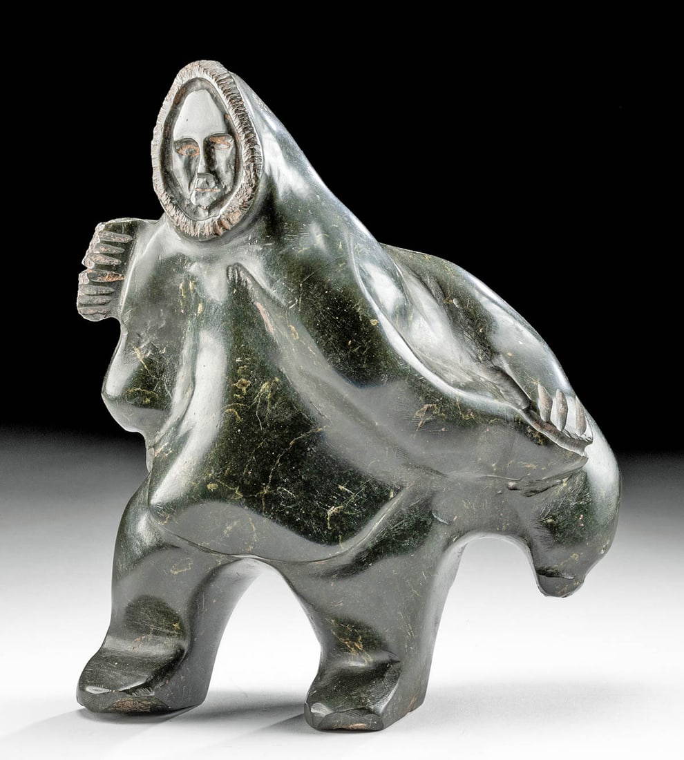Signed Inuit Stone Sculpture, Hunter Carrying Seal Auction
