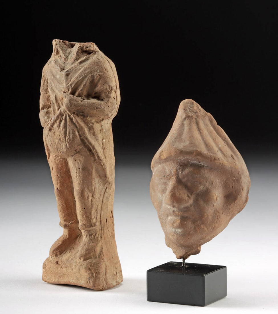 Roman Pottery Grotesque Head + Standing Beggar Figure Auction