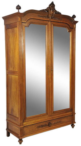 A Louis Xvi Style Armoire With Carved Crest And Rib