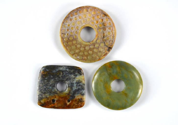 Three Chinese Carved Jade Disc Pendants