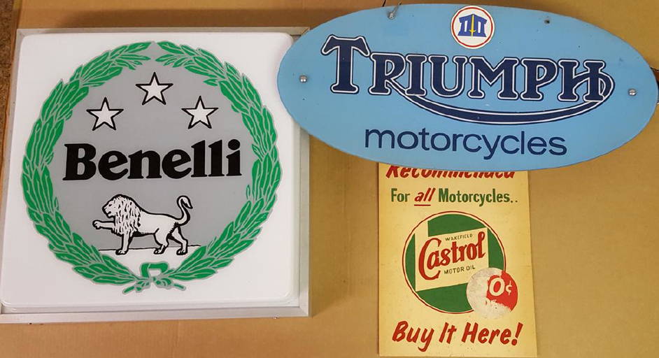 Three Motorcycle Advertising Signs