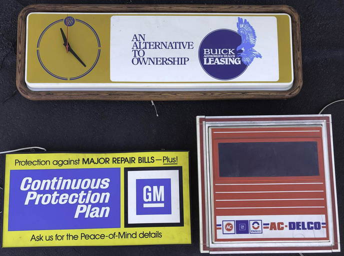 Three Illuminated Clock Signs