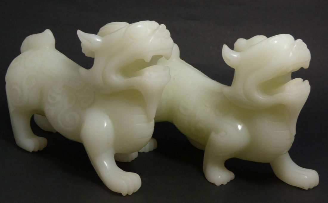 Pr Of Chinese Hand Carved White Jade Foo Dogs