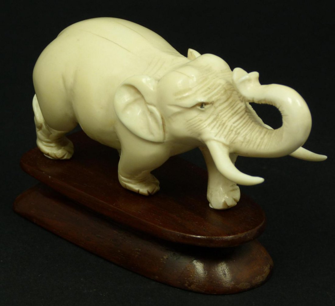 283: ANTIQUE HAND CARVED IVORY ELEPHANT