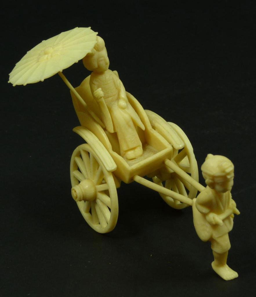 A Japanese Carved Ivory Rickshaw Figure
