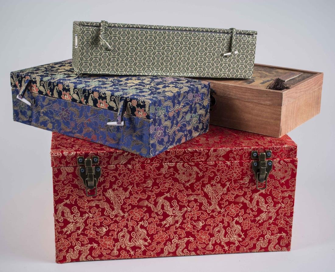 Four Chinese Silk Covered Storage Boxes
