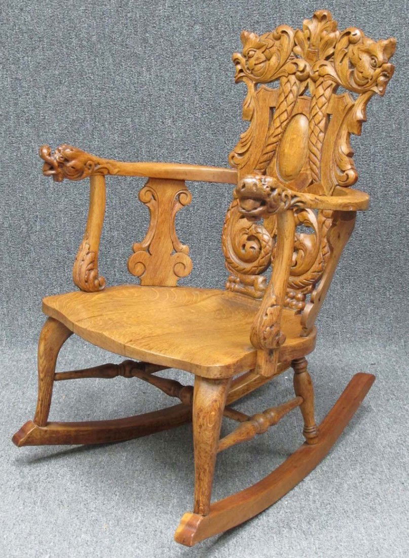 1309: R.J. HORNER CARVED OAK ROCKING CHAIR with griffin