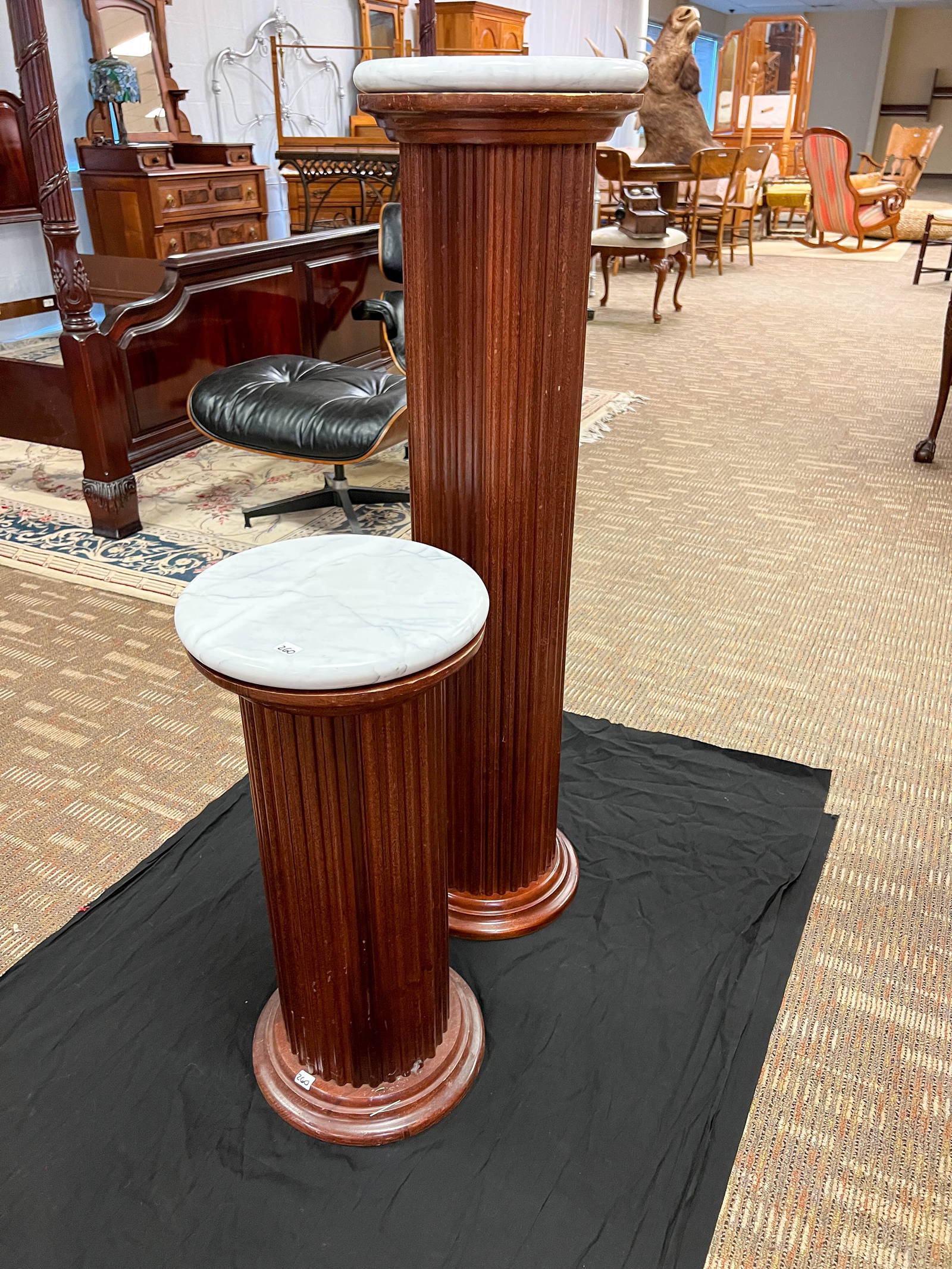 Pair Of Graduated Fluted Columns With White Marble Tops Auction
