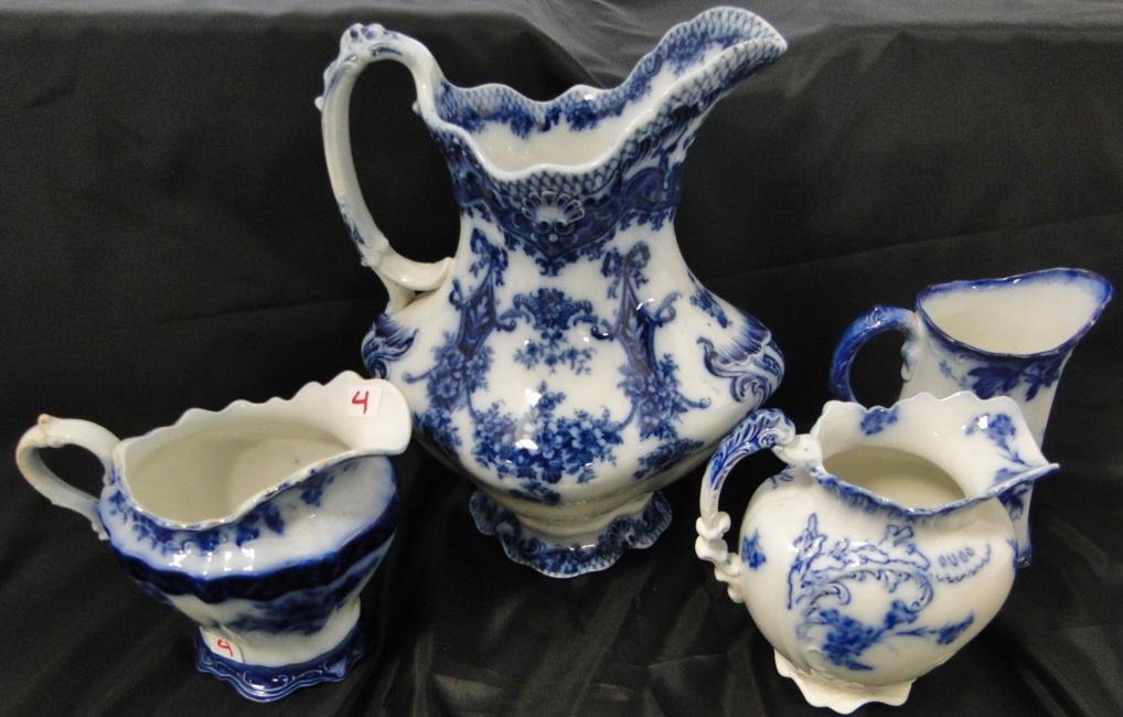 Group Of 4 Flow Blue Pitchers To Inlcude A Large Water