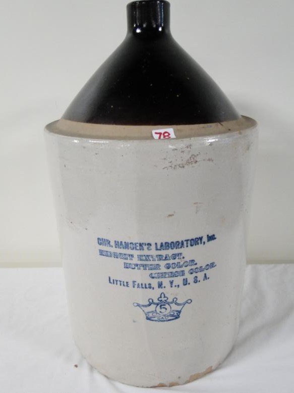 A two-tone 5 gallon crown mark stoneware jug with