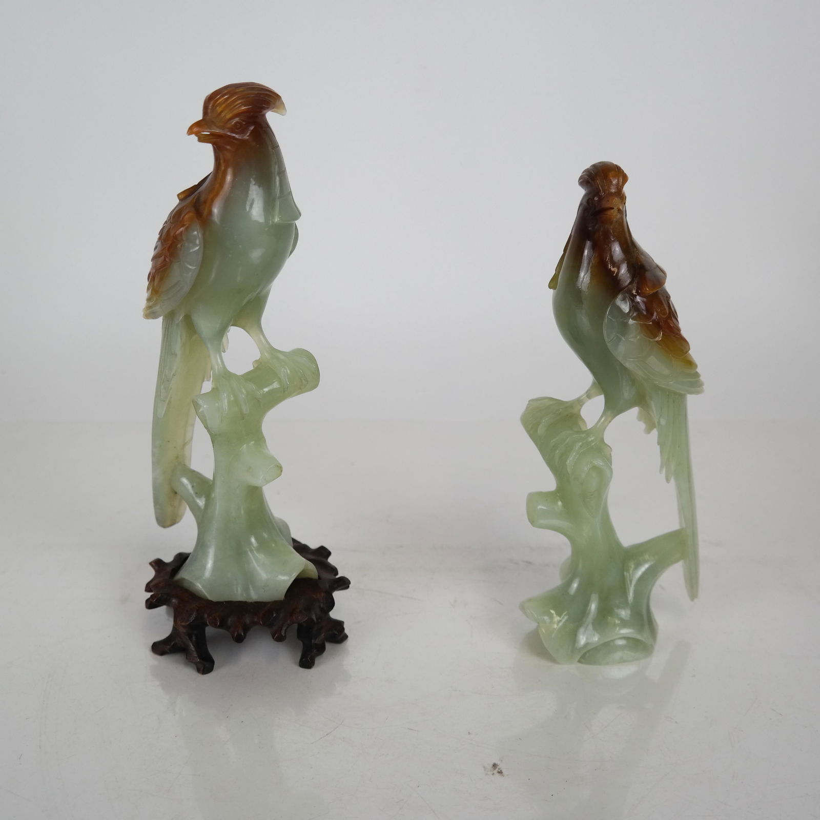 Two Chinese Green And Russet Jade Birds